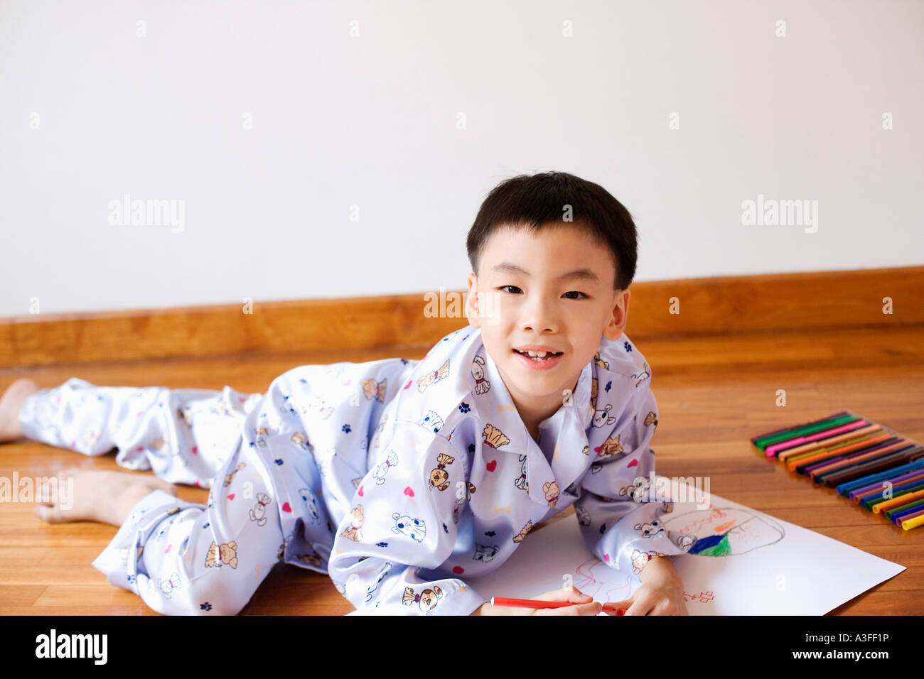 Portrait of a boy drawing on paper Stock Photo - Alamy