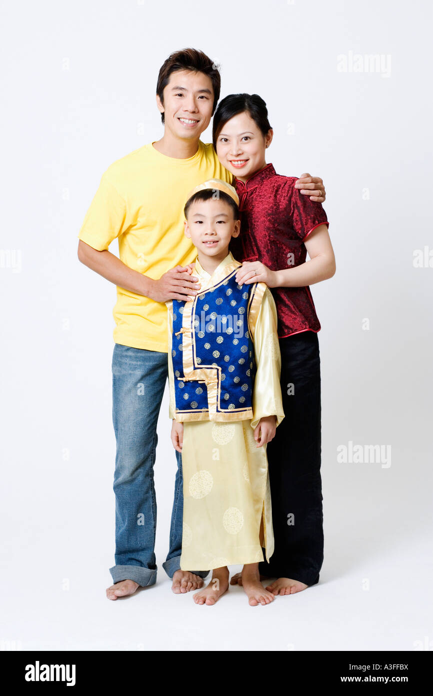 Portrait of a boy standing with his parents Stock Photo - Alamy