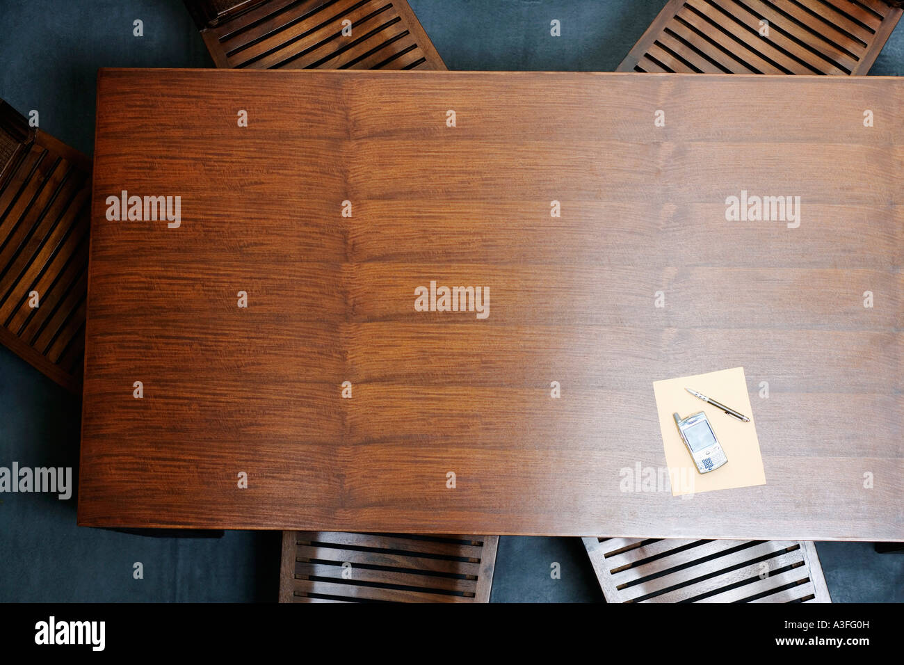 Mobile phone on the table with a notepad and a pen Stock Photo - Alamy