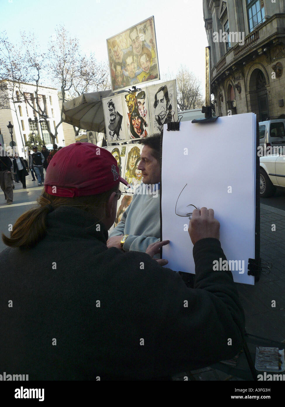 Street artist drawing caricature hi-res stock photography and images ...