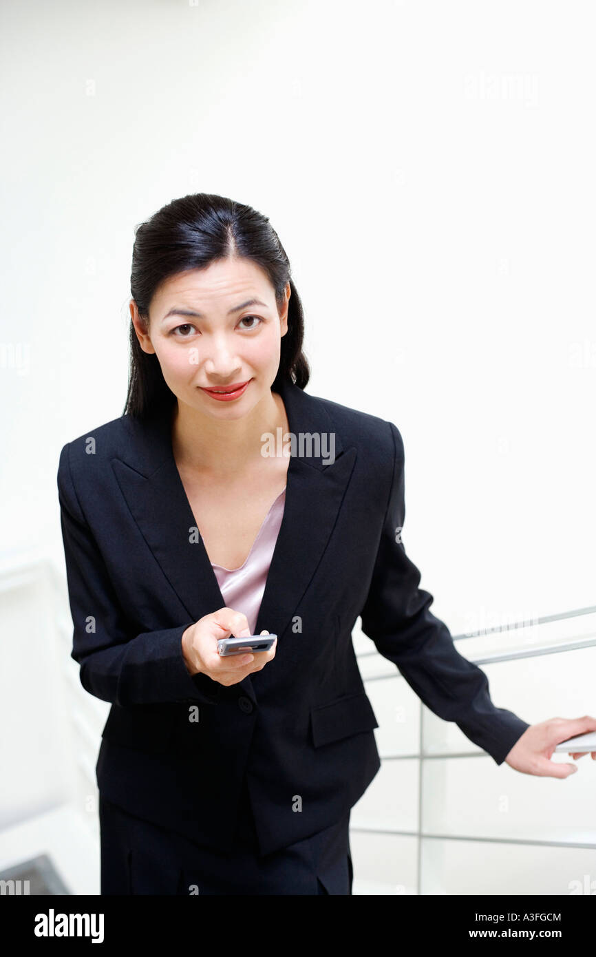 Portrait of a businesswoman operating a mobile phone Stock Photo - Alamy