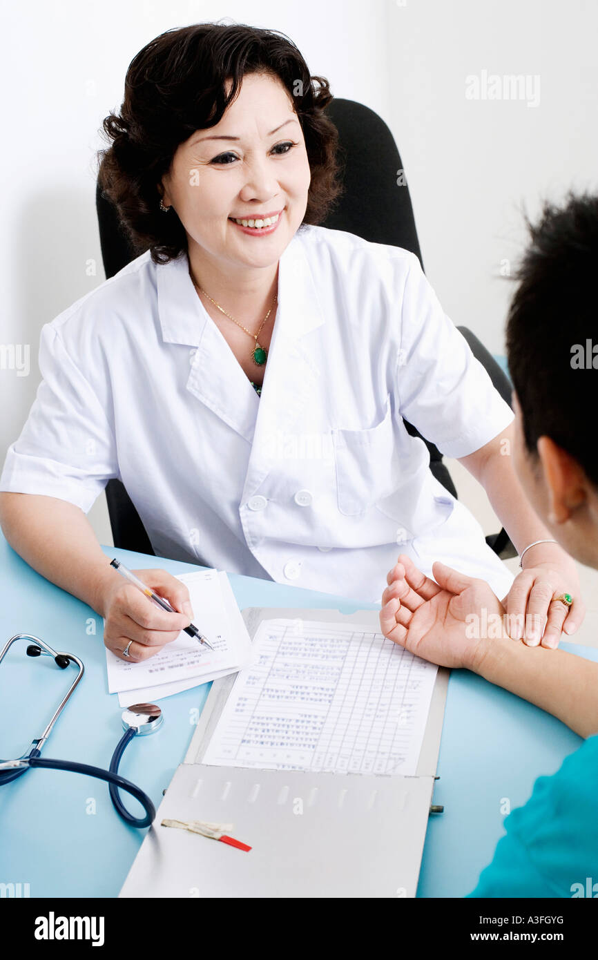 Taking pulse hi-res stock photography and images - Alamy