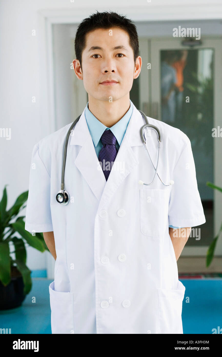 Portrait of a male doctor standing Stock Photo - Alamy