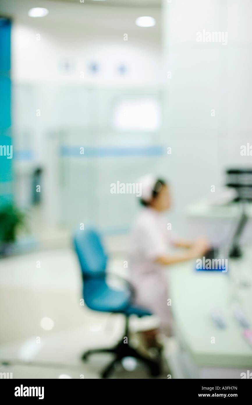 Side profile of a female nurse sitting on a chair Stock Photo - Alamy