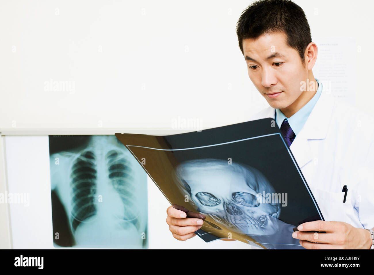Close-up of a male doctor examining an X-Ray Stock Photo - Alamy