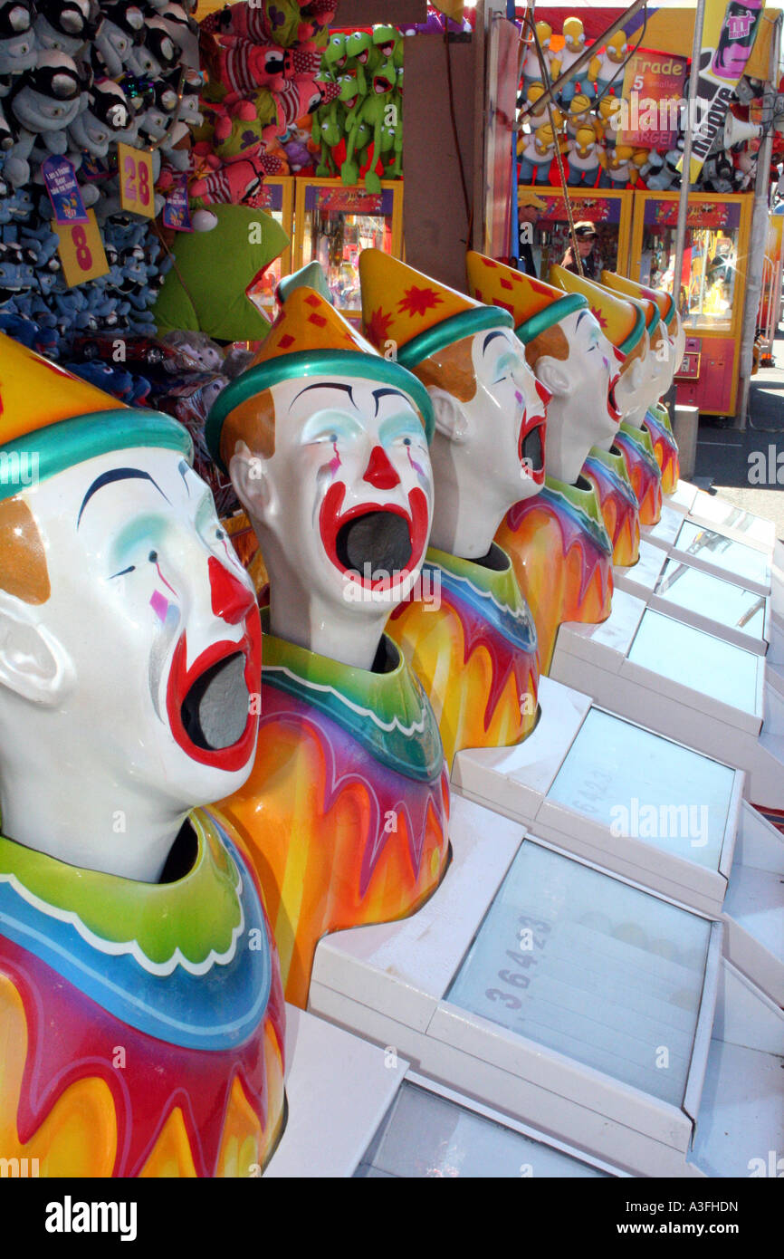 A ROW OF CLOWNS IN SIDE SHOW ALLEY BAPDA8960 Stock Photo - Alamy