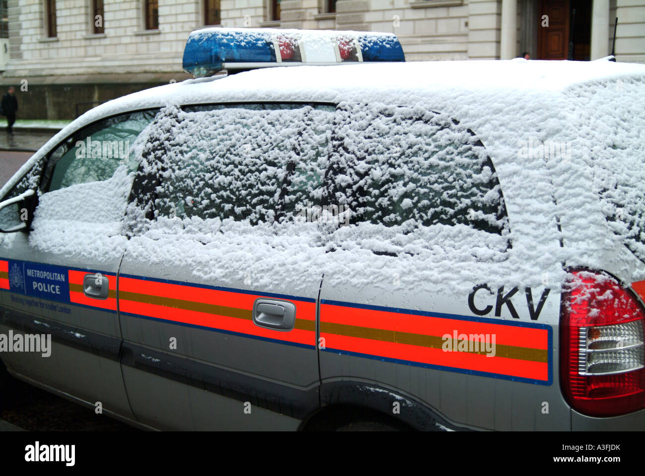 Police car in the snow in London Stock Photo - Alamy