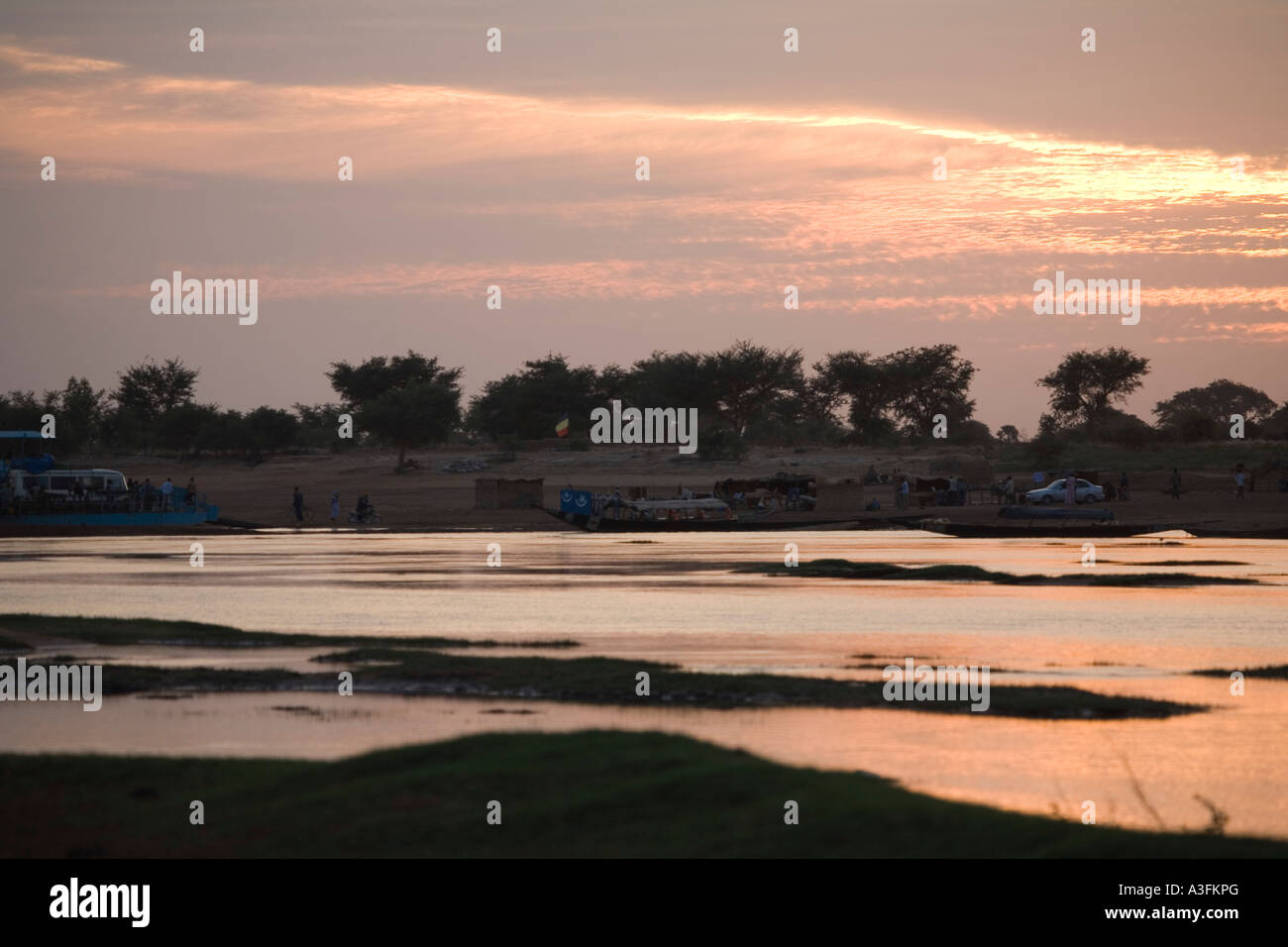 Trees line a shallow, sandy river just outside Djenne, Mali Stock Photo ...