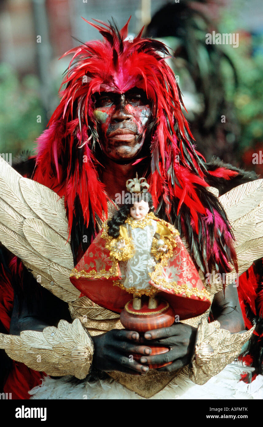 Philippines, Aklan, Kalibo, dancer with Saint Nino at the Ati Atihan ...