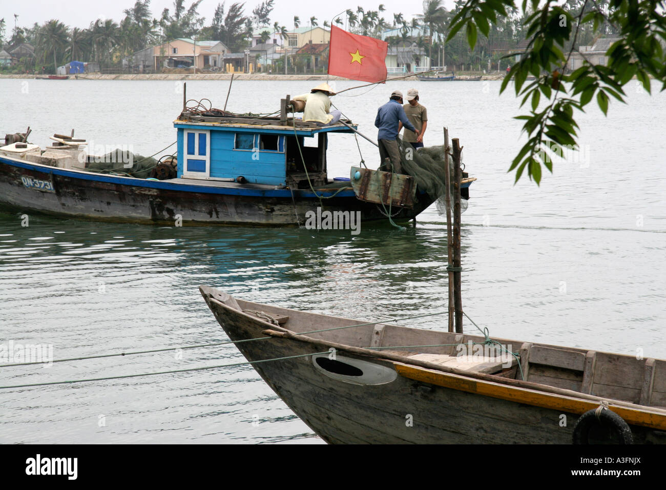 Hoi an boat on canal with communist flag hi-res stock photography and ...