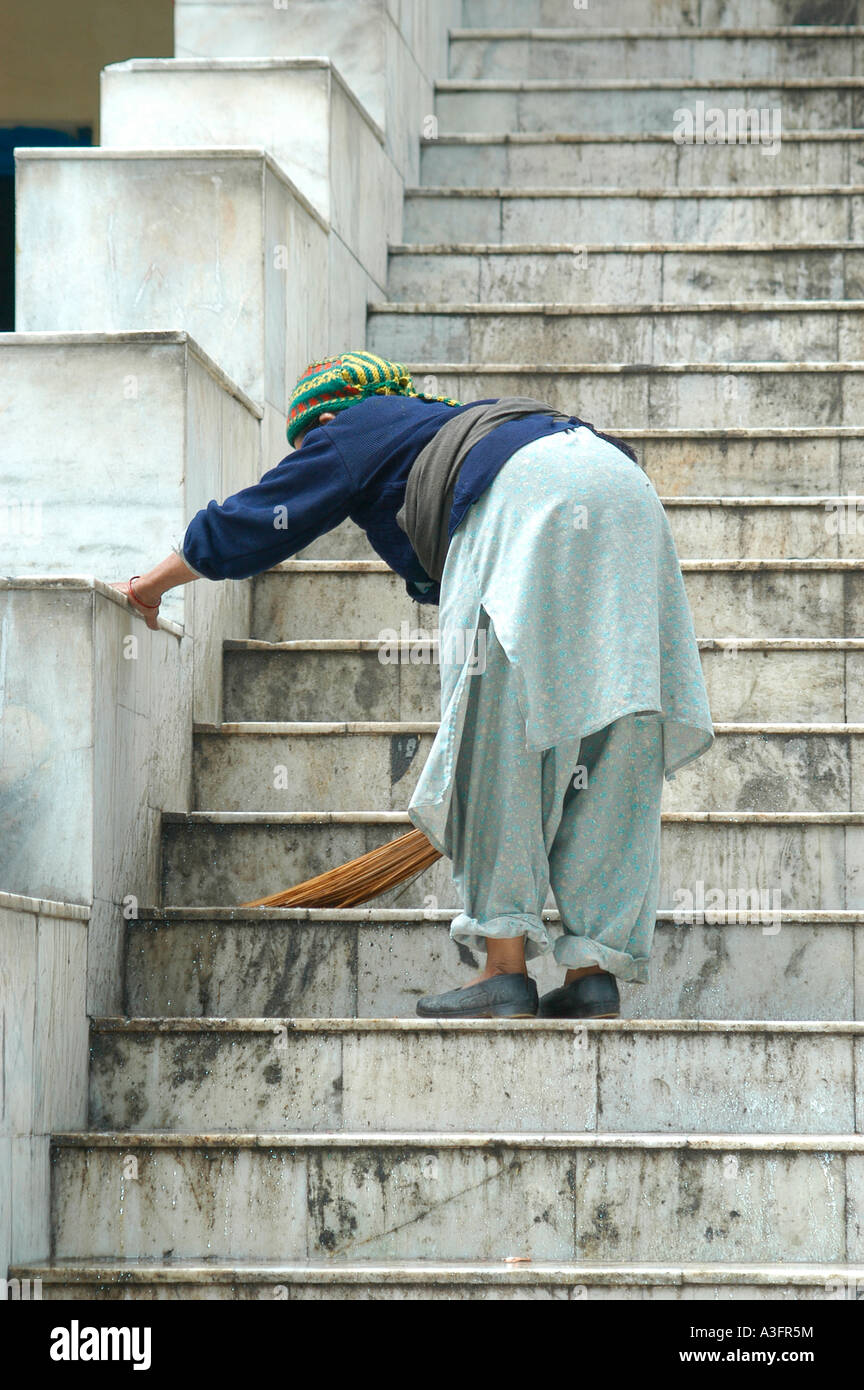 Woman sweeping stairs hi-res stock photography and images - Alamy