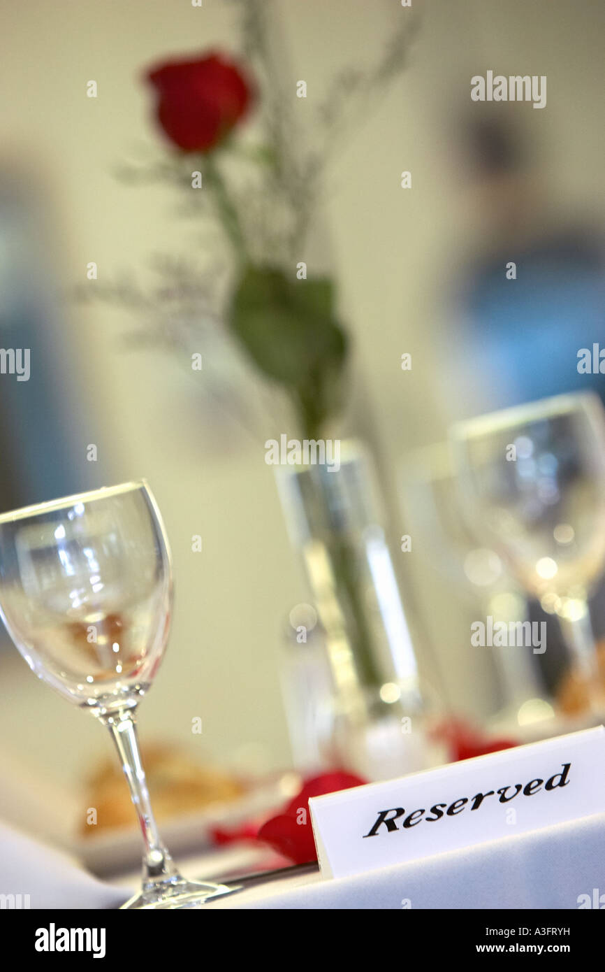 Table setting at a restaurant Paper placard on the table reads reserved ...