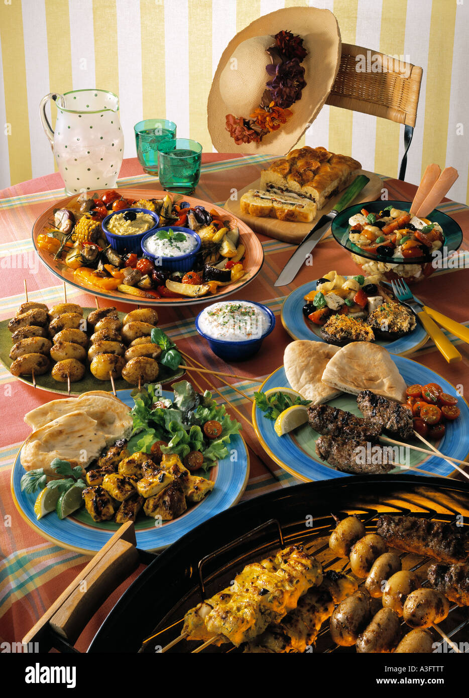 A table full of barbecued food Stock Photo - Alamy