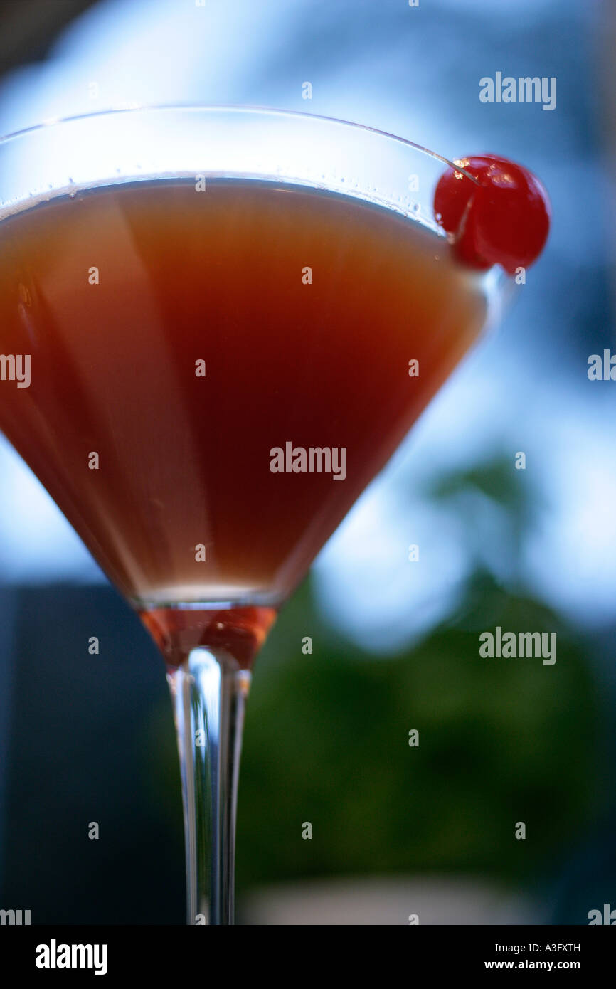 Whiskey cocktail with a cherry garnish Stock Photo - Alamy