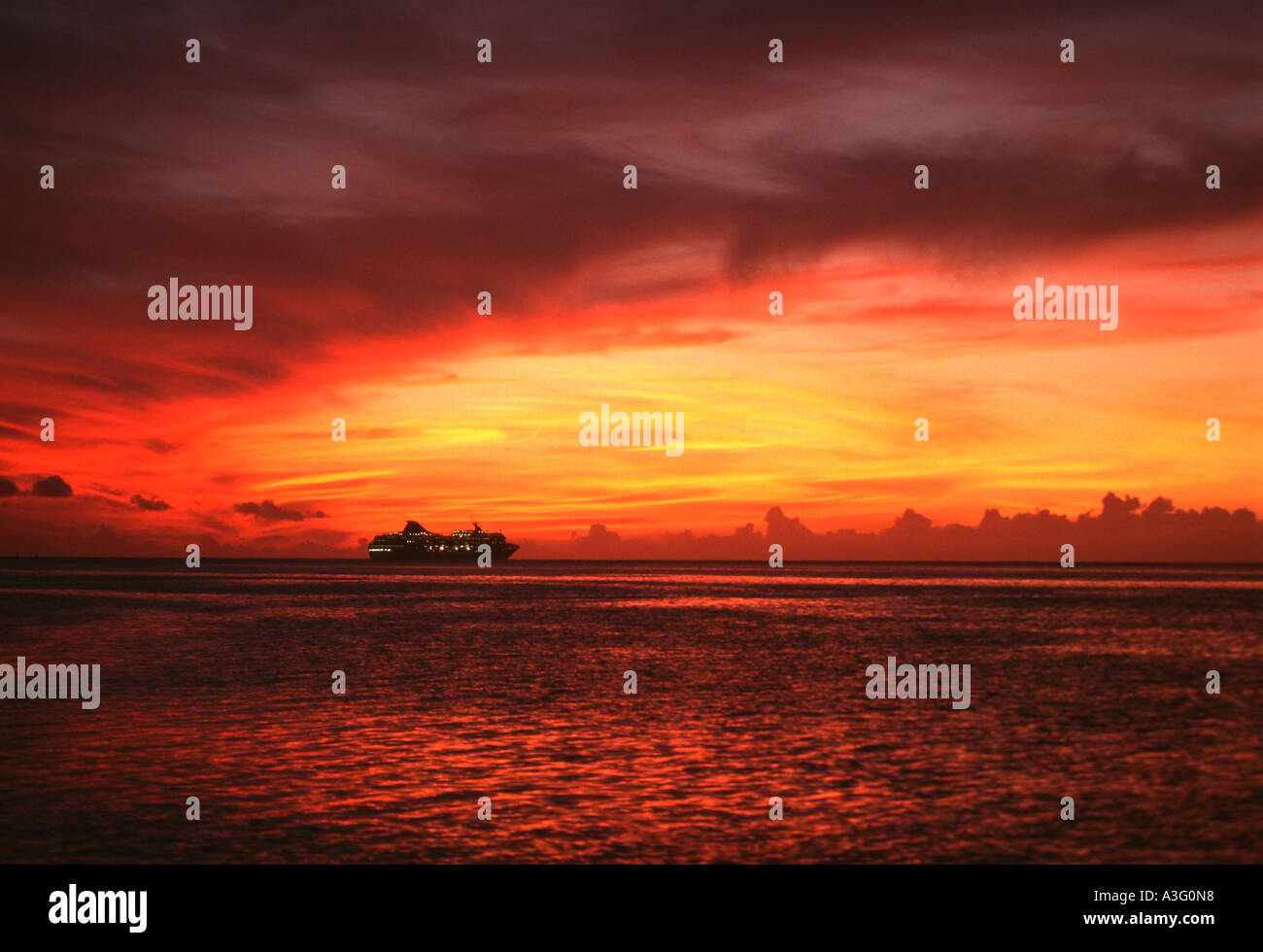 Cruise ship at sunset Stock Photo - Alamy