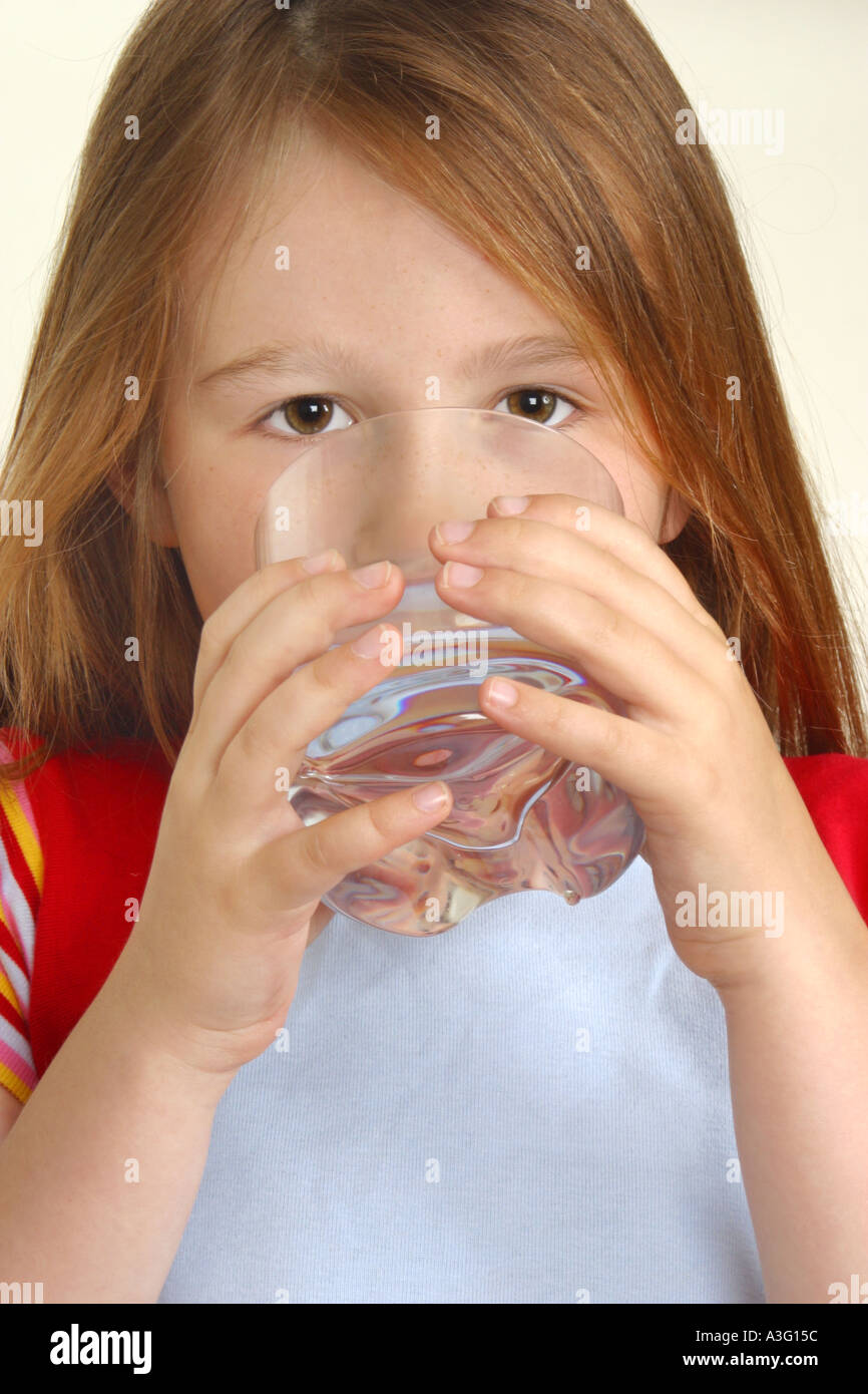 Girl drinking glass of water Stock Photo - Alamy