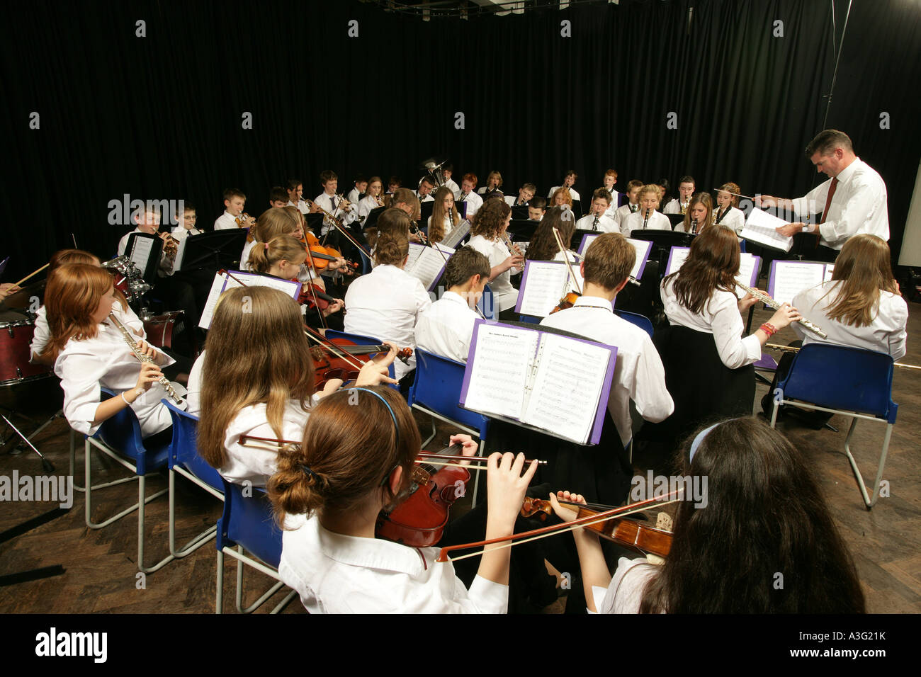 School Band with teacher conducting Stock Photo - Alamy
