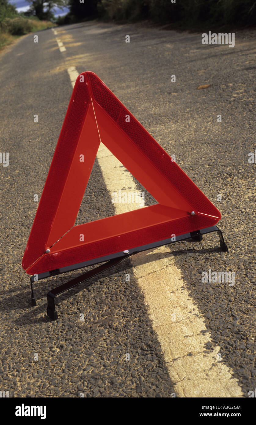 emergency warning triangle on country road warning of possible danger ...