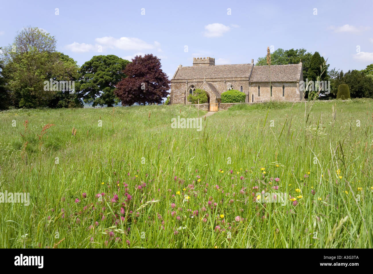 St Peter's church in the Cotswold village of Little Rissington ...