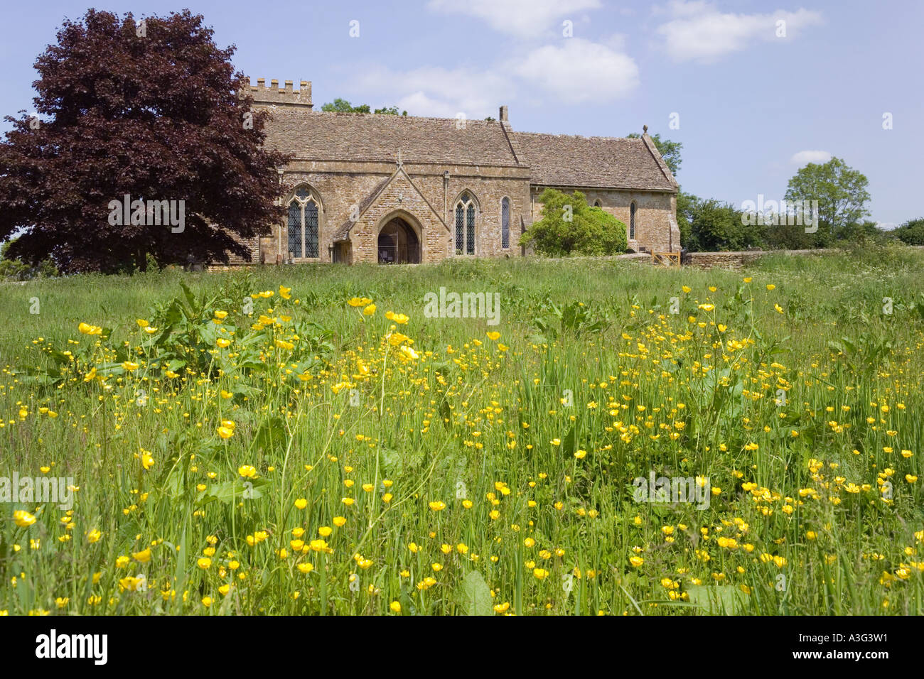 St Peter's church in the Cotswold village of Little Rissington ...