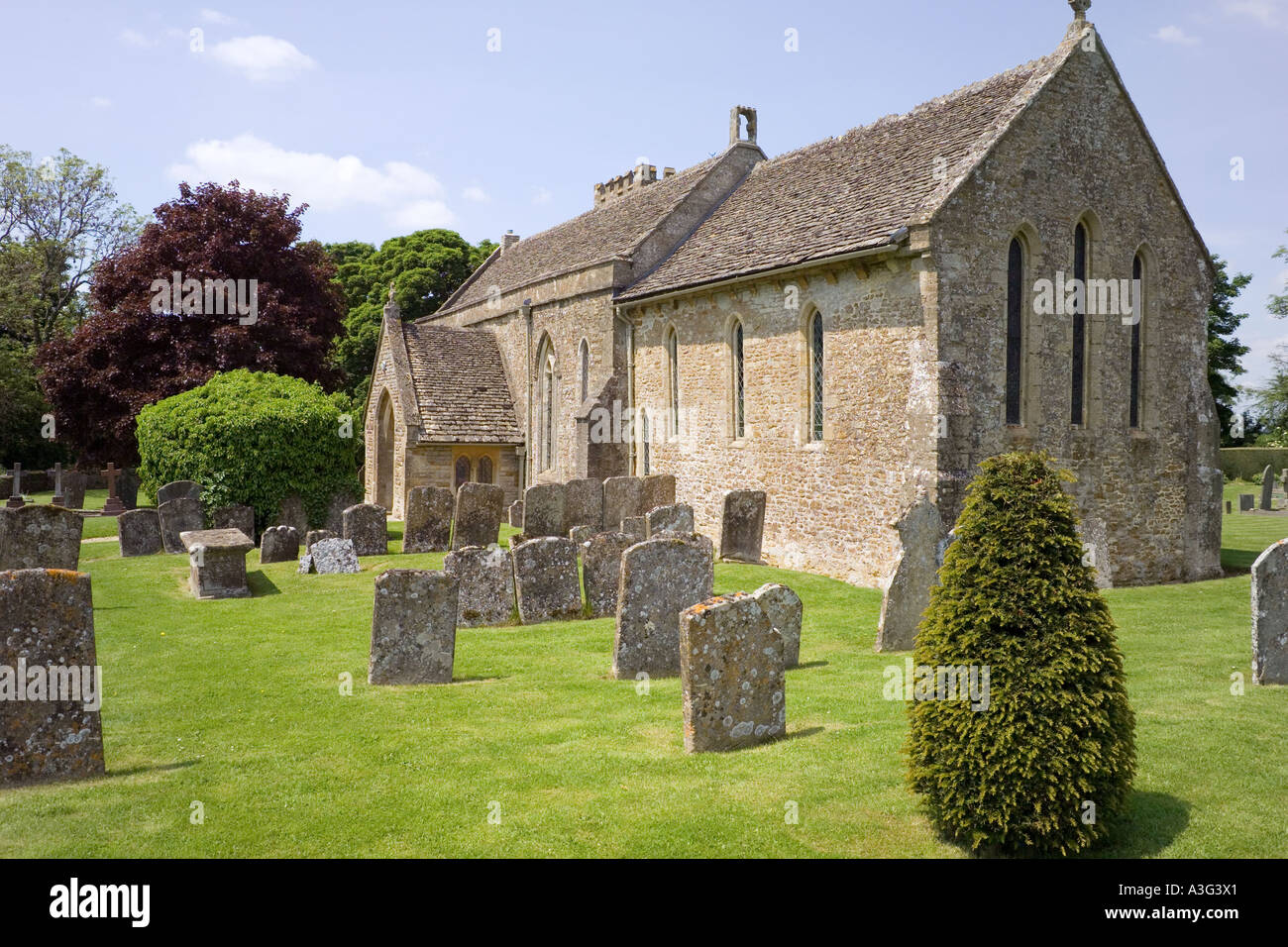 St Peter's church in the Cotswold village of Little Rissington ...