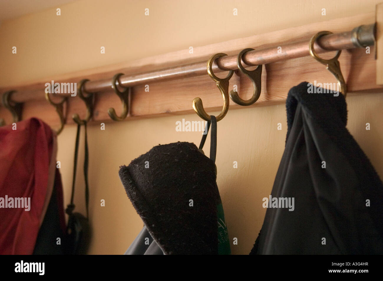 Coats hanging up home hi-res stock photography and images - Alamy
