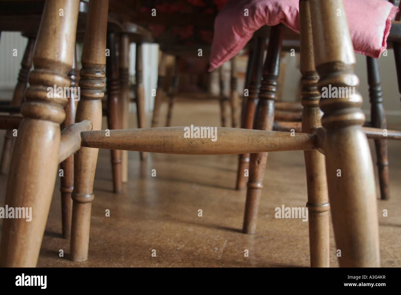 View through chair legs underneath a kitchen table Stock Photo - Alamy