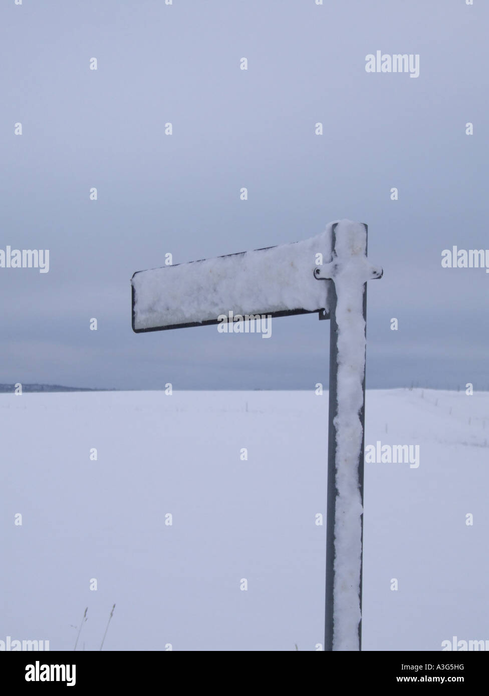 road sign covered with heavy snow Stock Photo - Alamy