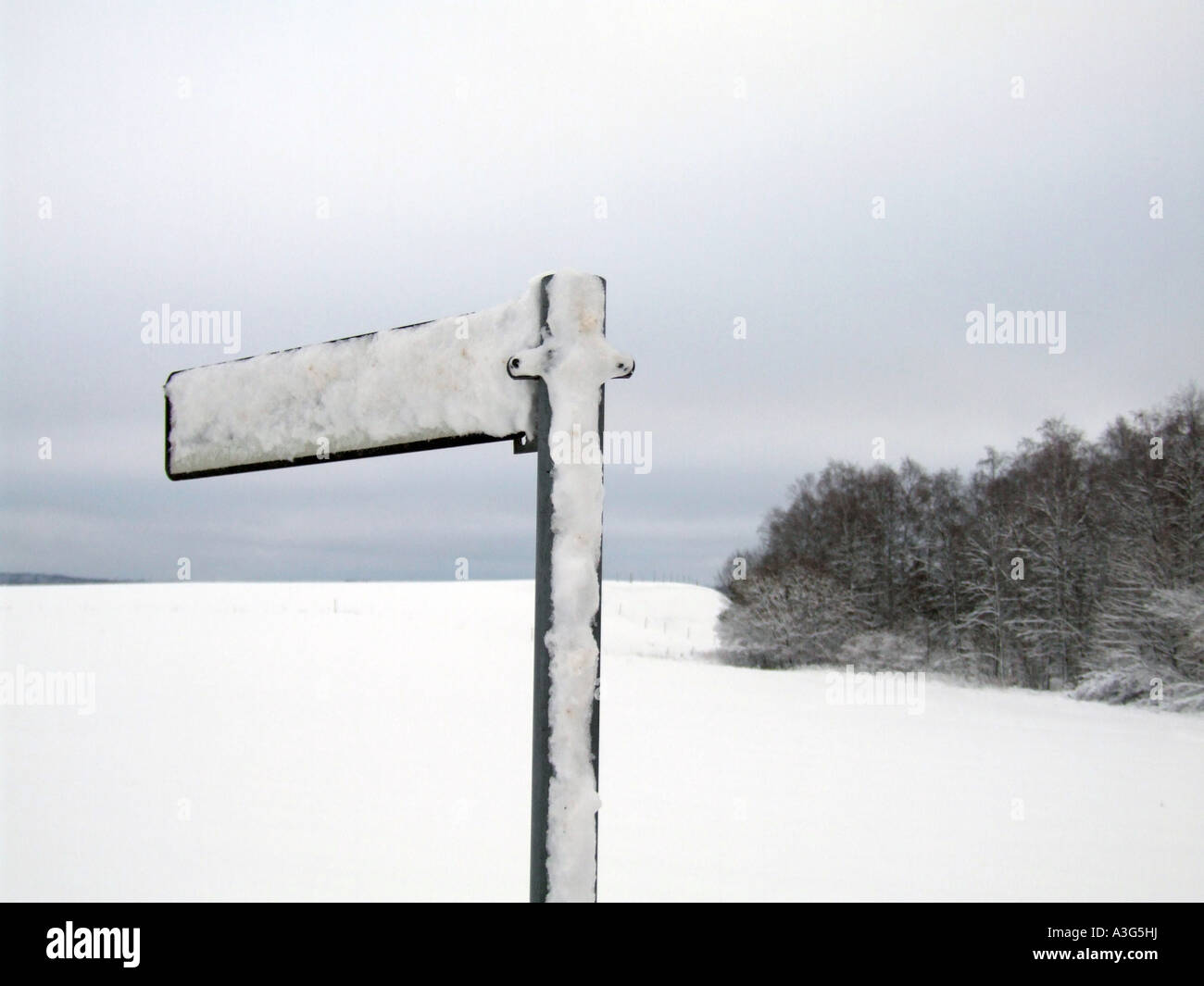 road sign covered with heavy snow Stock Photo - Alamy