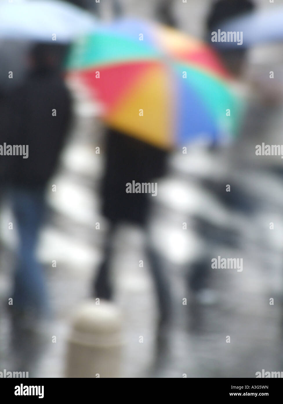 person carrying umbrella in town Stock Photo - Alamy