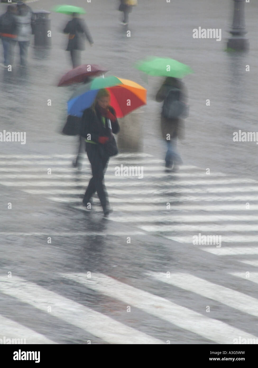 people carrying umbrella in town Stock Photo - Alamy