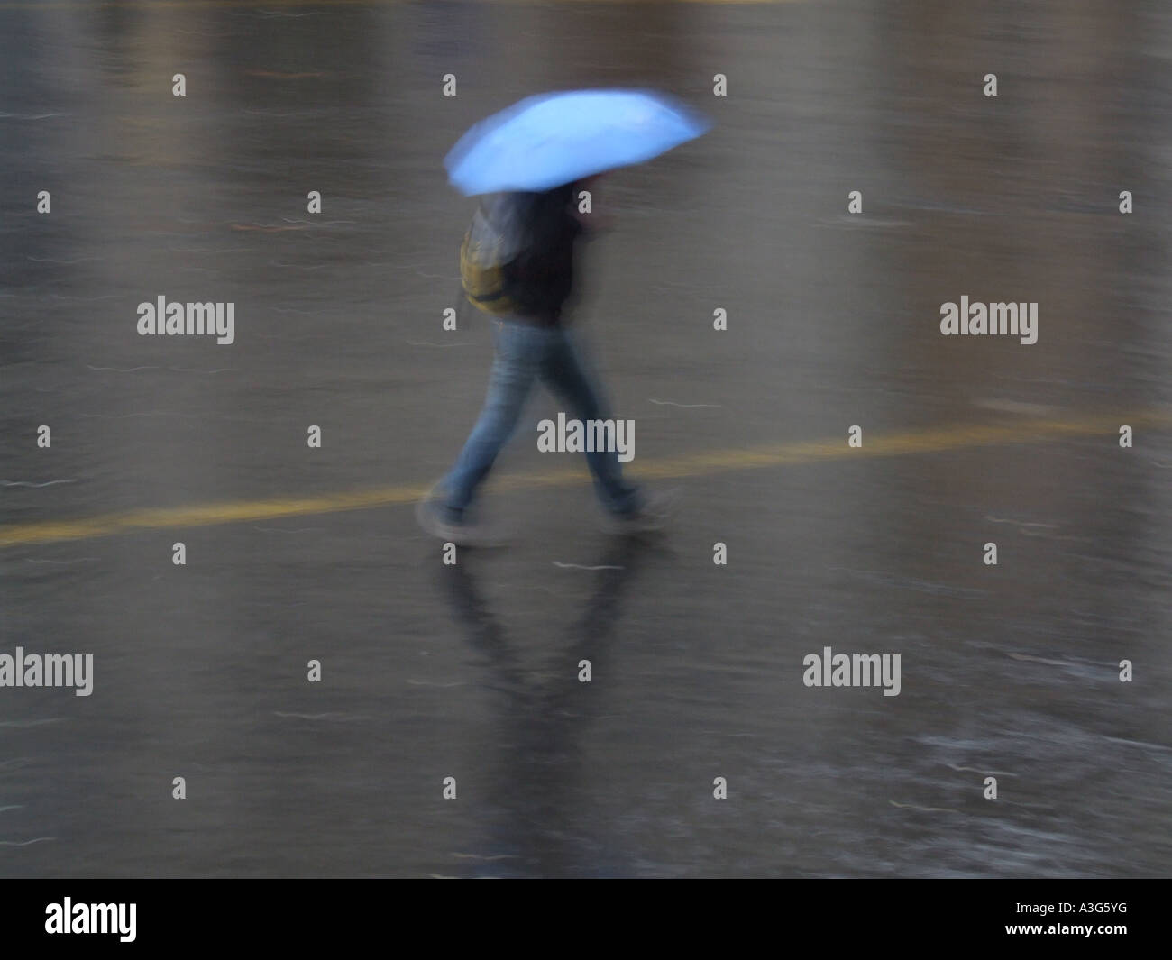 person carrying umbrella in town Stock Photo - Alamy