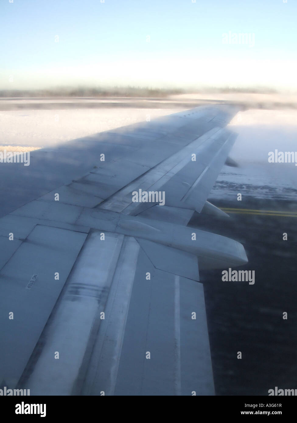 view of budget carrier plane wing and sunset on take off Stock Photo ...
