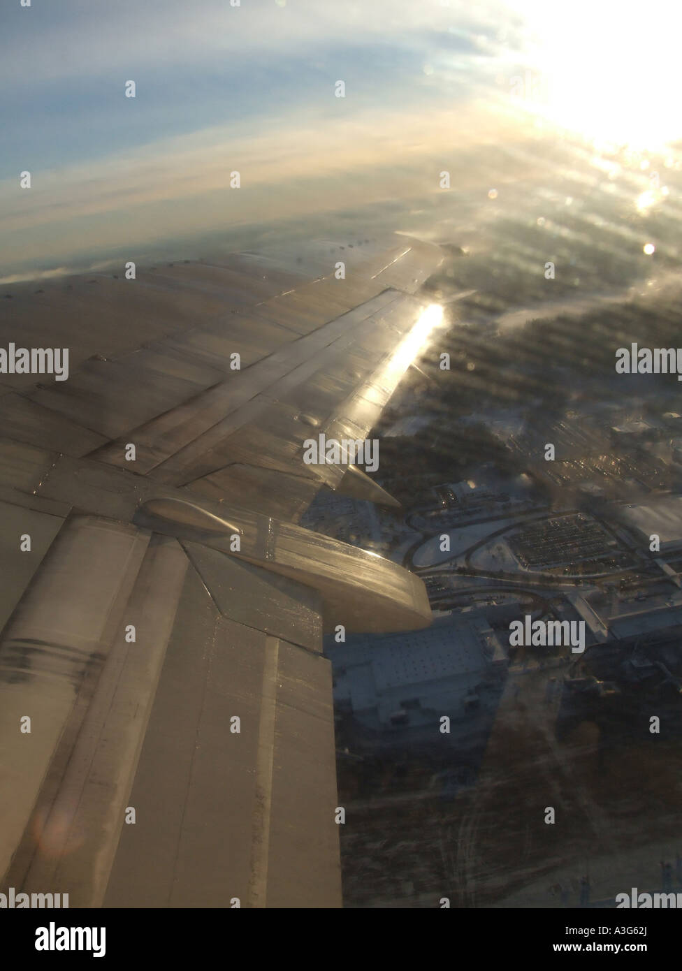 view of budget carrier plane wing and sunset on take off Stock Photo ...