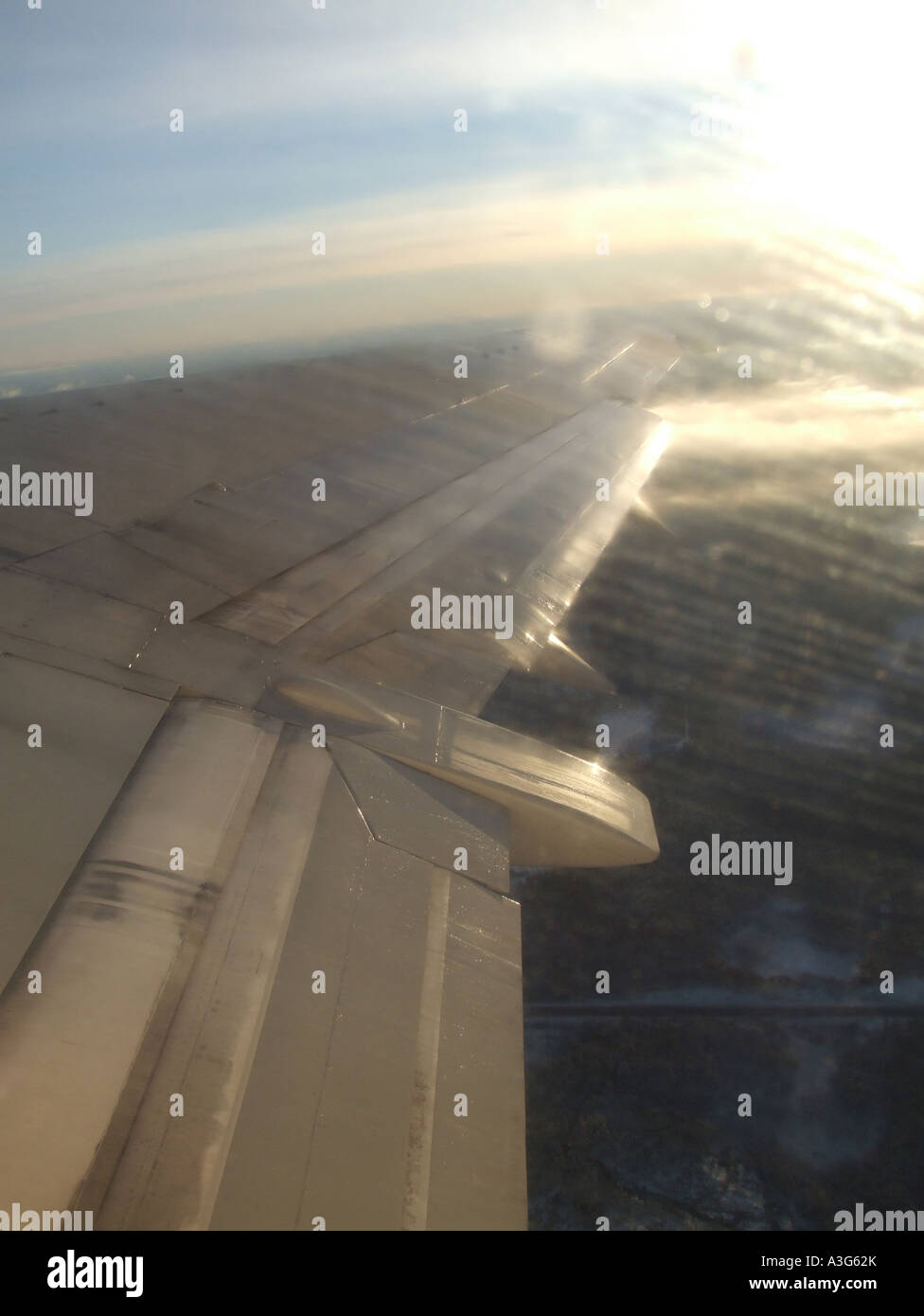 view of budget carrier plane wing and sunset on take off Stock Photo ...