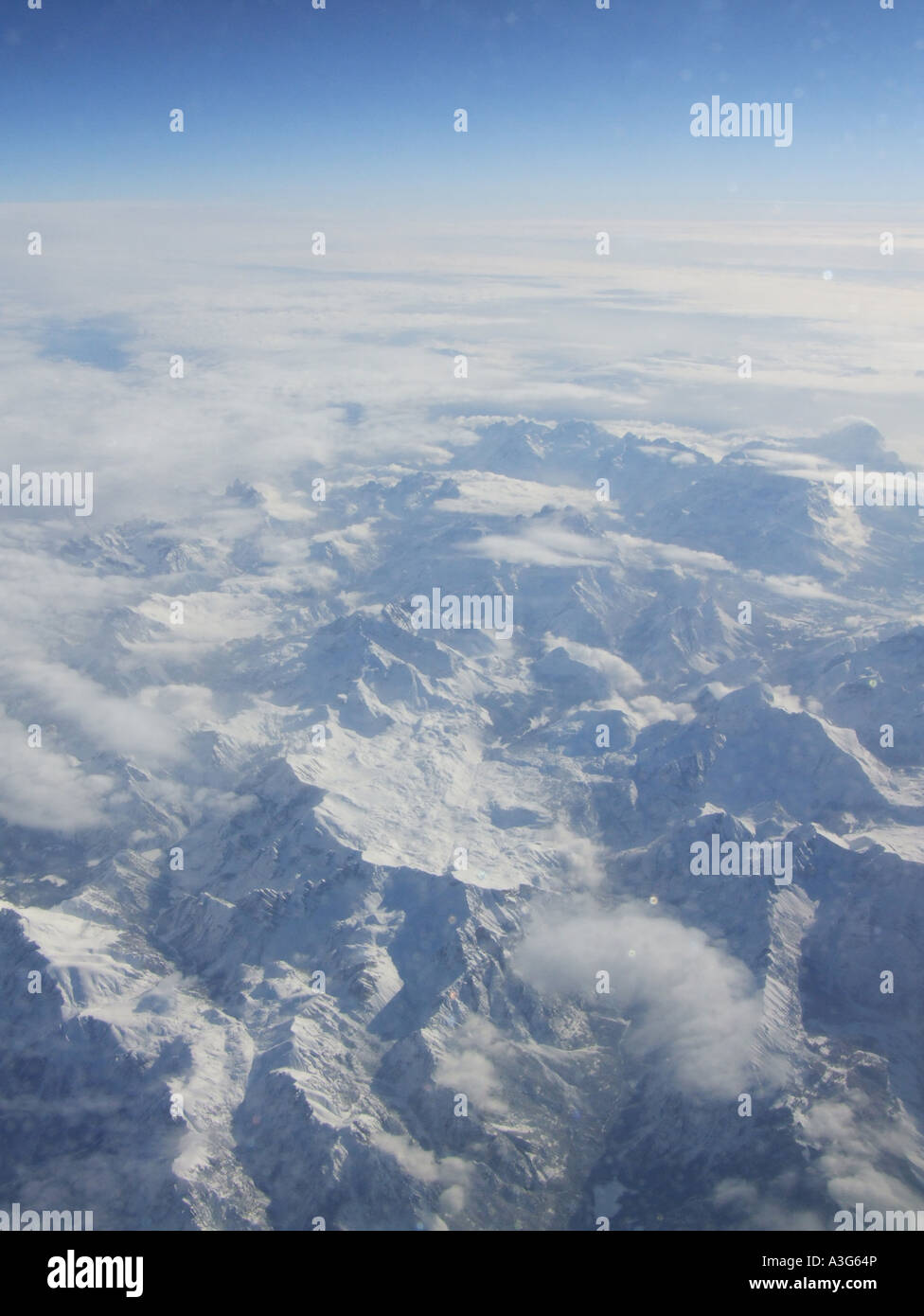 alps mountain range seen from plane window Stock Photo - Alamy
