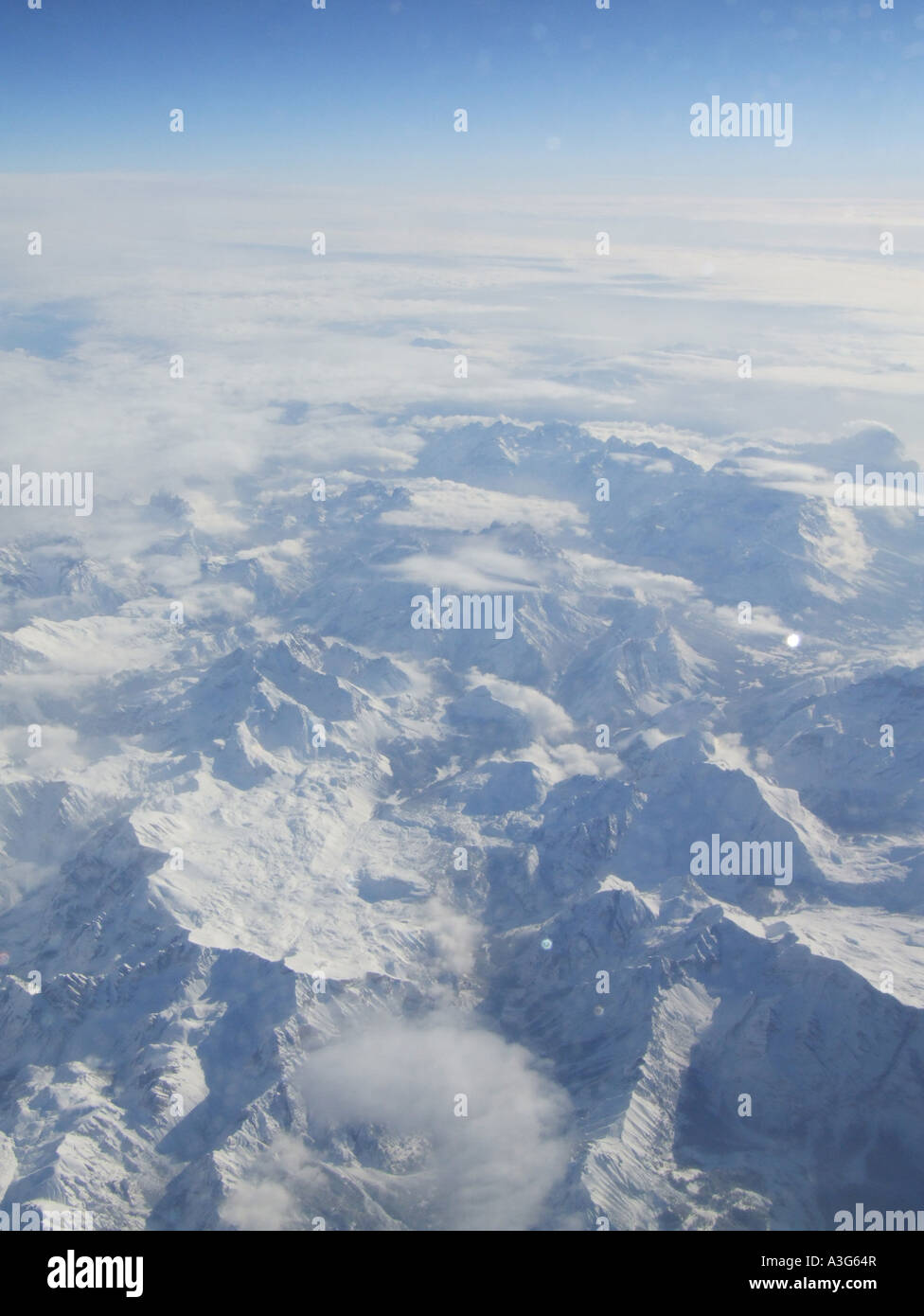 alps mountain range seen from plane window Stock Photo - Alamy