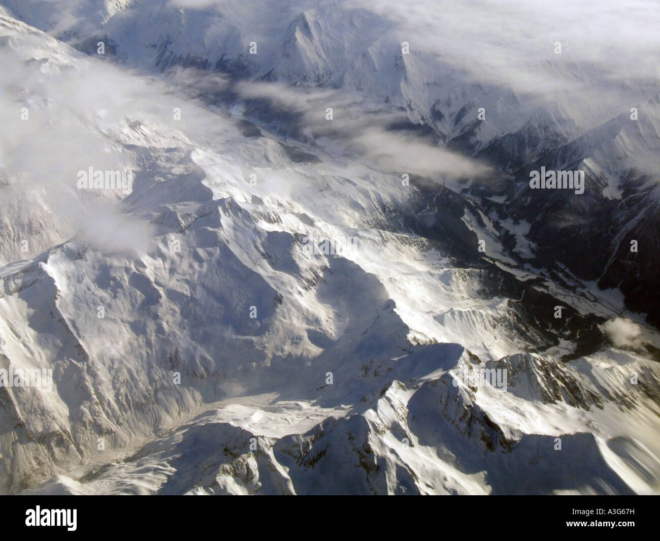 alps mountain range seen from plane window Stock Photo - Alamy