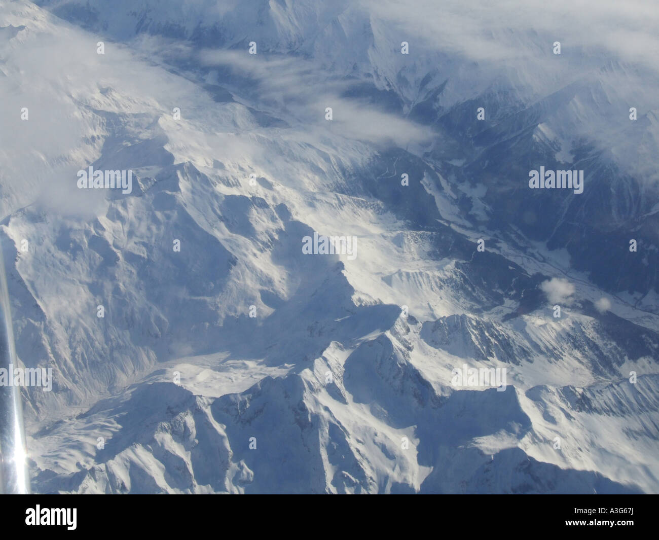 alps mountain range seen from plane window Stock Photo - Alamy