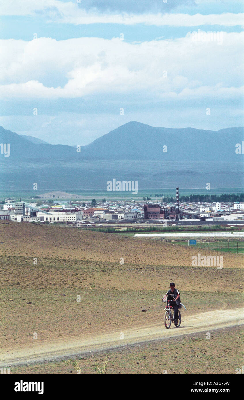 Boy riding bicycle. Ulaangom aimak (province center). Uvs aimag ...