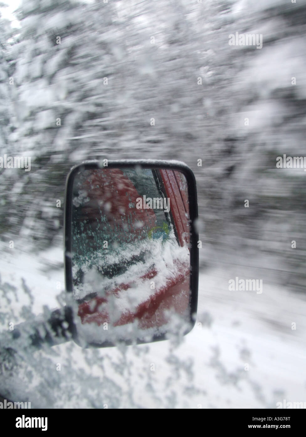 car driving in heavy snow on rural country road Stock Photo - Alamy