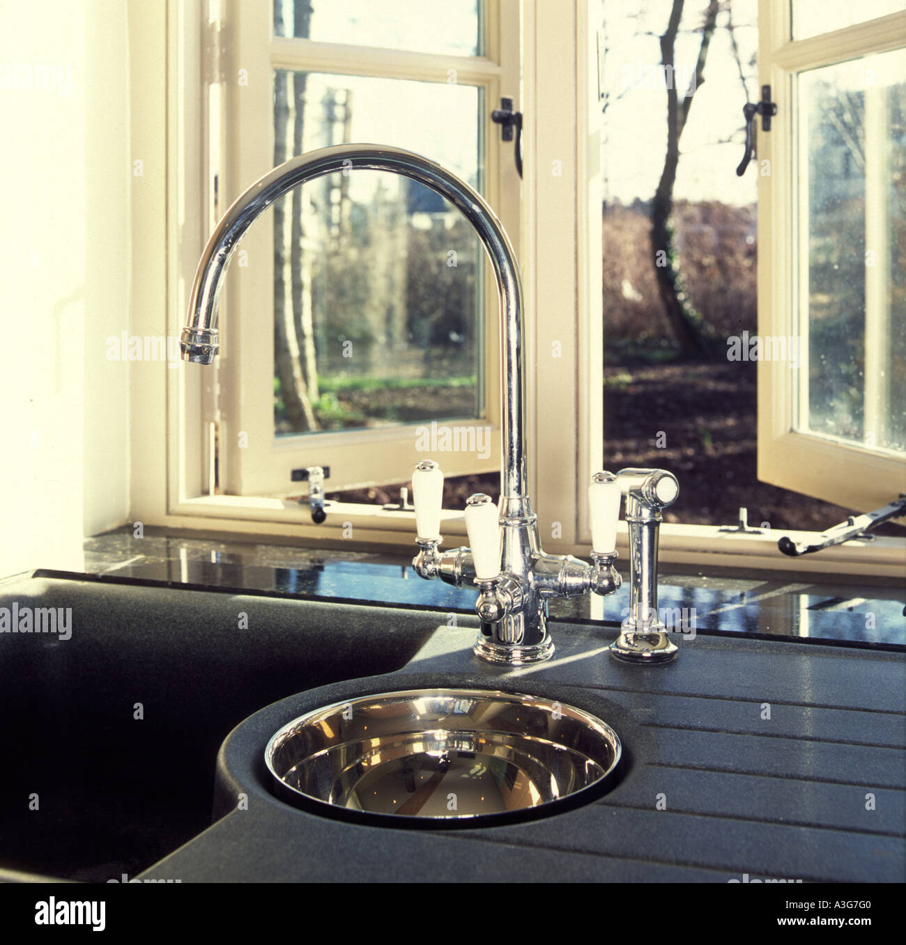 Interior, kitchen taps and sink detail, open window Stock Photo - Alamy