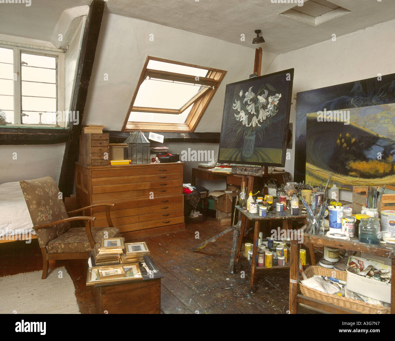 Interior, attic room used as artists studio space Stock Photo - Alamy