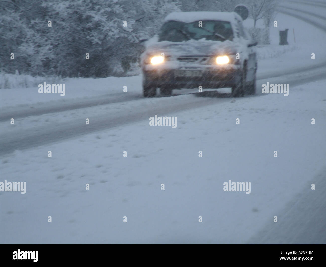 one car driving in heavy snow in sweden Stock Photo - Alamy
