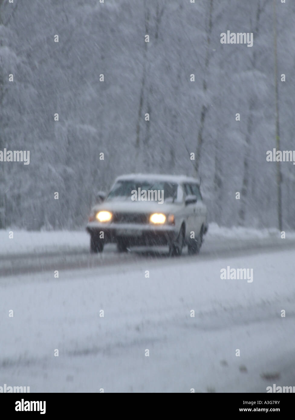one car driving in heavy snow in sweden Stock Photo - Alamy