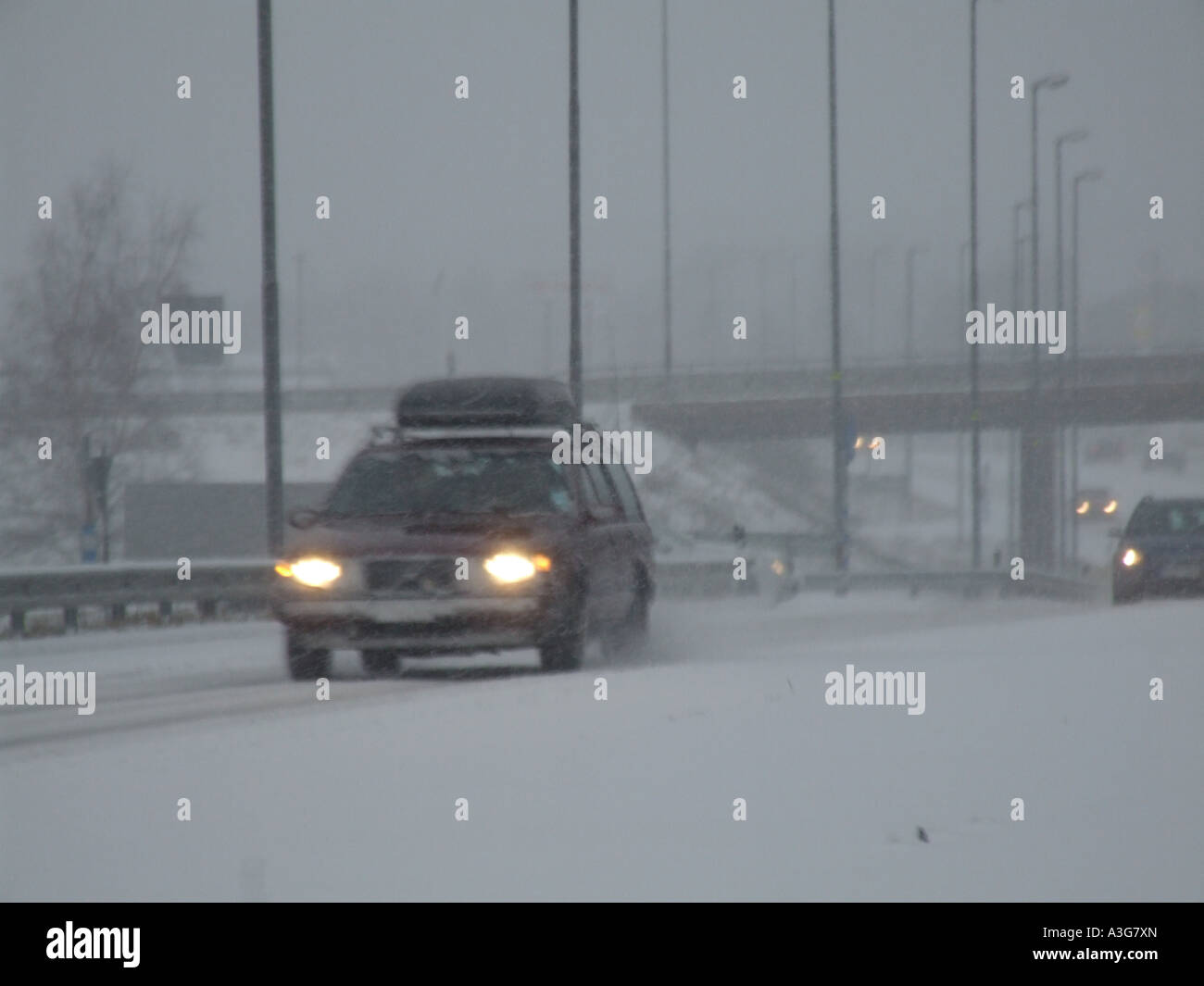 one car driving in heavy snow in sweden Stock Photo - Alamy