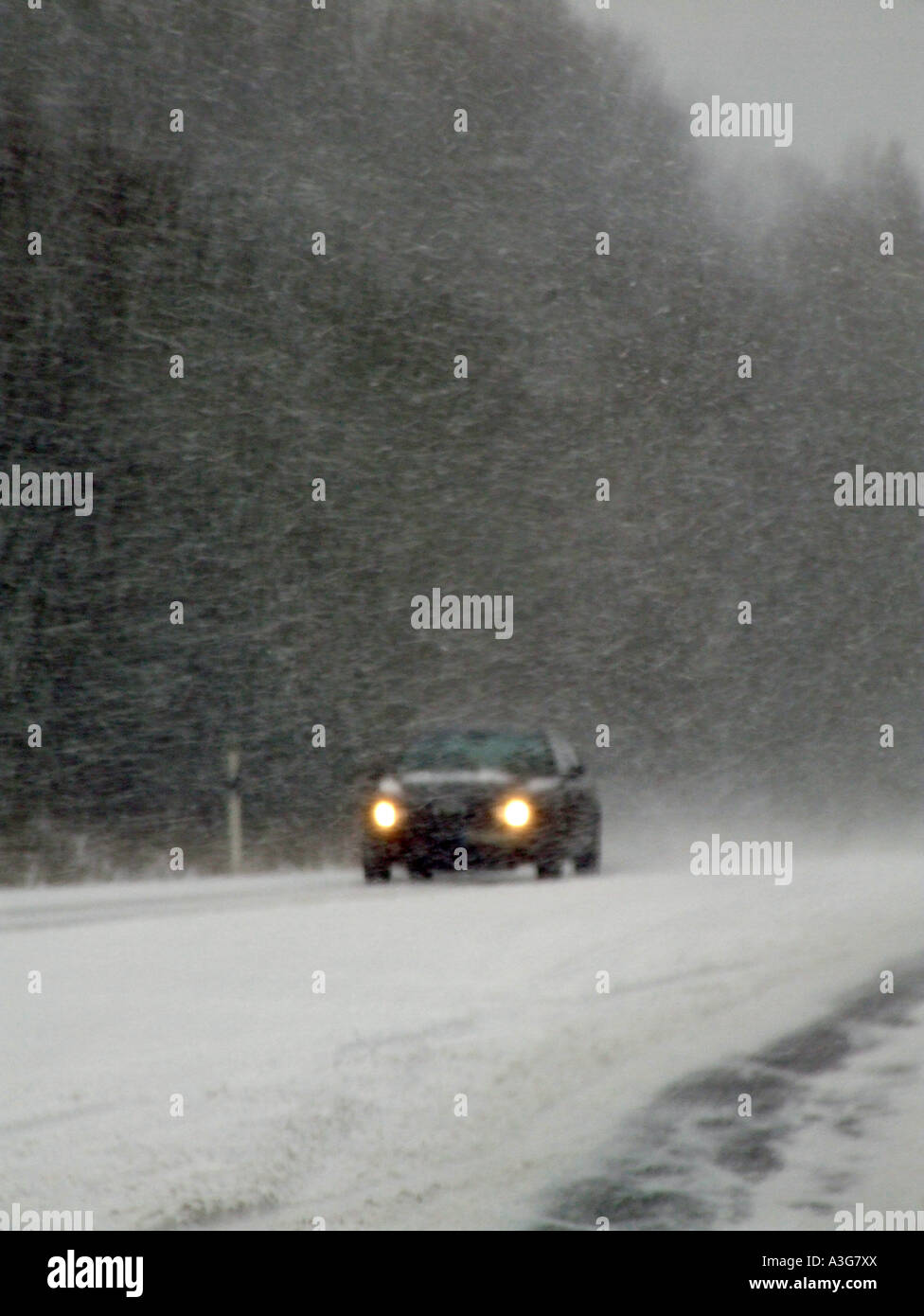 one car driving in heavy snow in sweden Stock Photo - Alamy