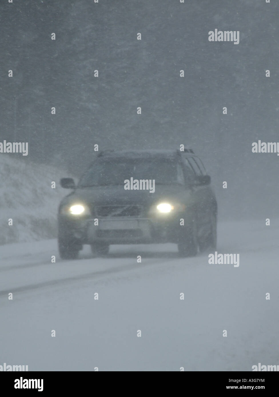 one car driving in heavy snow in sweden Stock Photo - Alamy