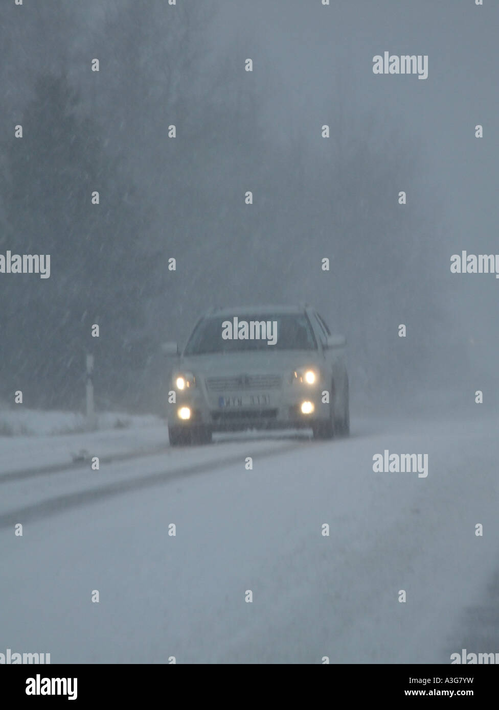 one car driving in heavy snow in sweden Stock Photo - Alamy
