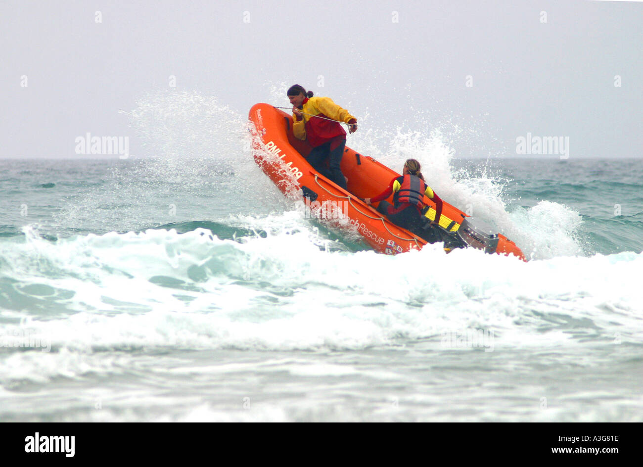 RNLI Beach Lifeguards practicing boat drills at Porthtowan Cornwall UK ...